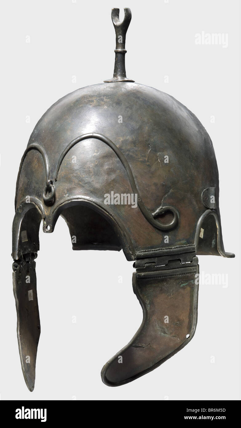 A Chalcidian helmet, . A curved, decorative band riveted to the brow ...