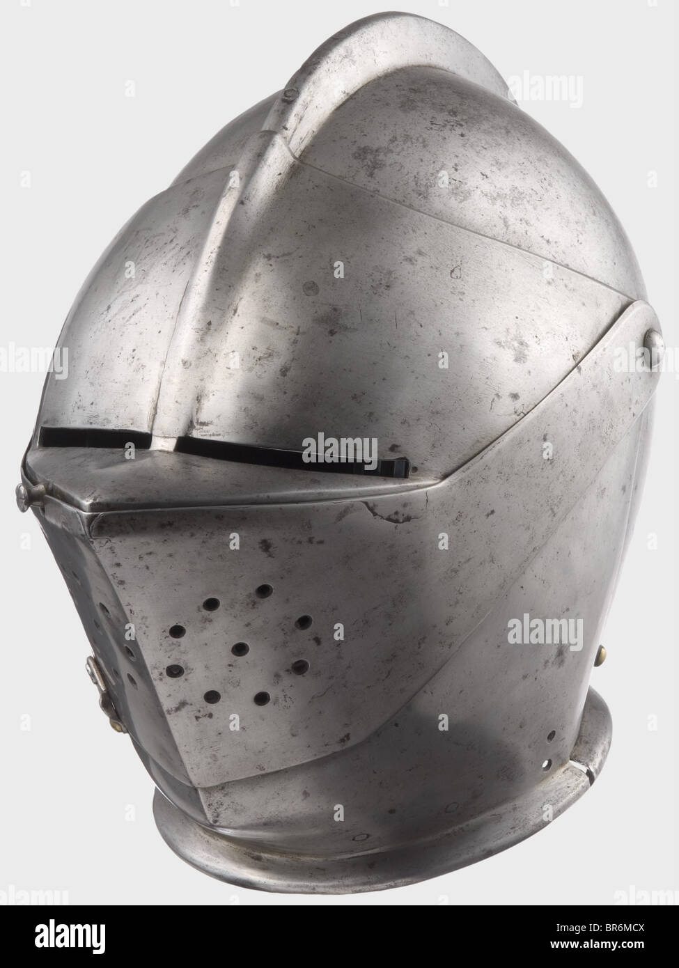 A German close helmet, circa 1570/80. Skull made in two pieces with a ...