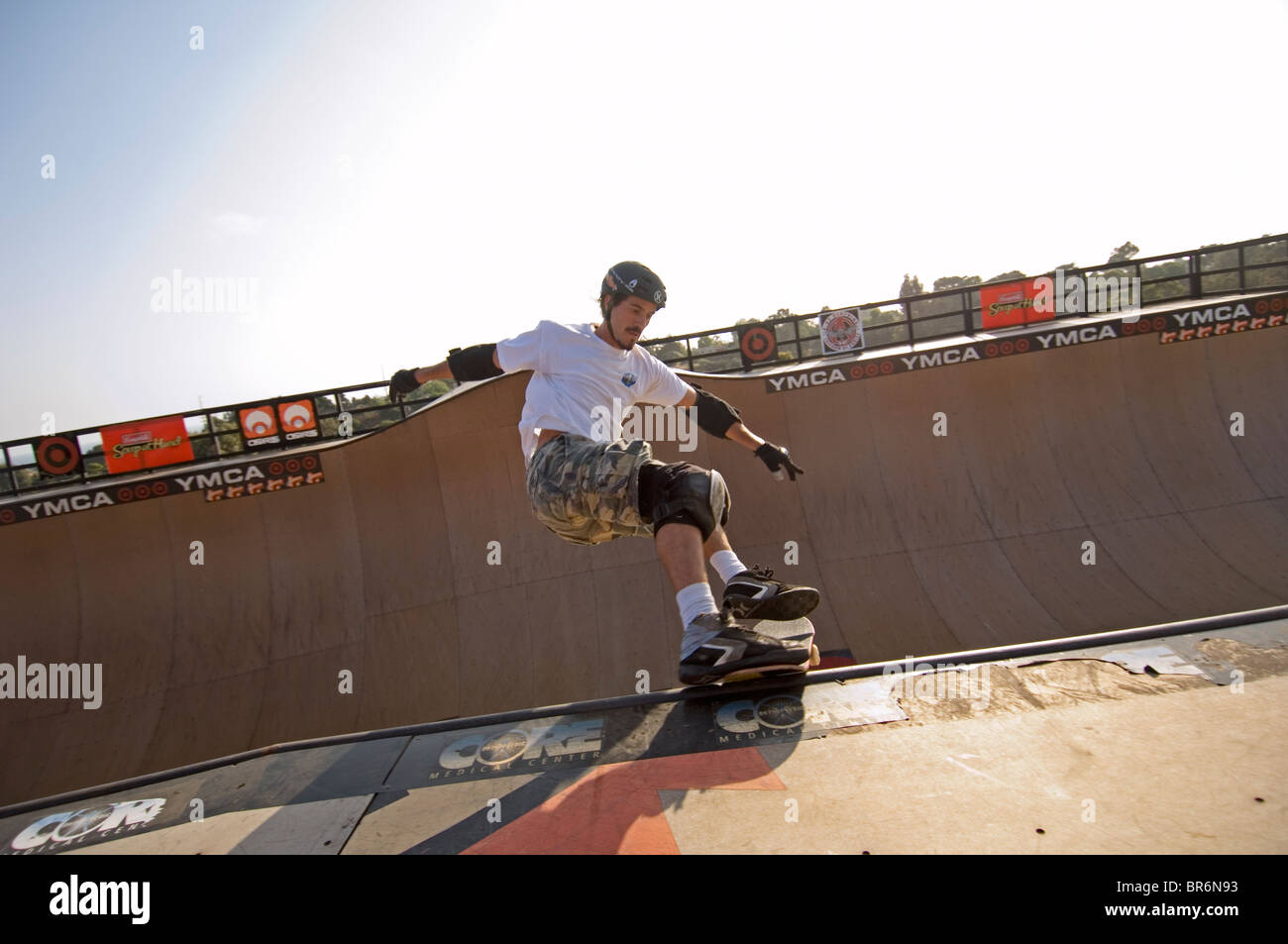 Pro skater Bob Burnquist practicing a trick on his skateboard shortly ...