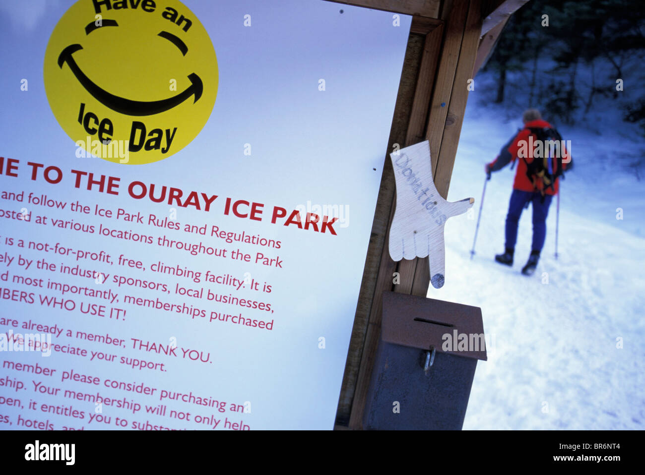 A shot of a man entering the Ouray Ice Park in which the sign is in the ...