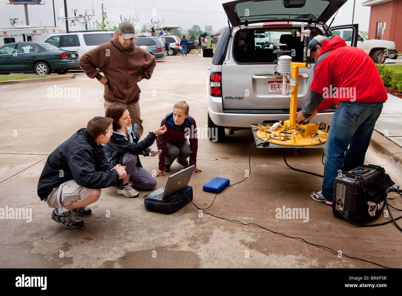 Vortex 2 scientists prepare a tornado pod, a probe designed to measure ...