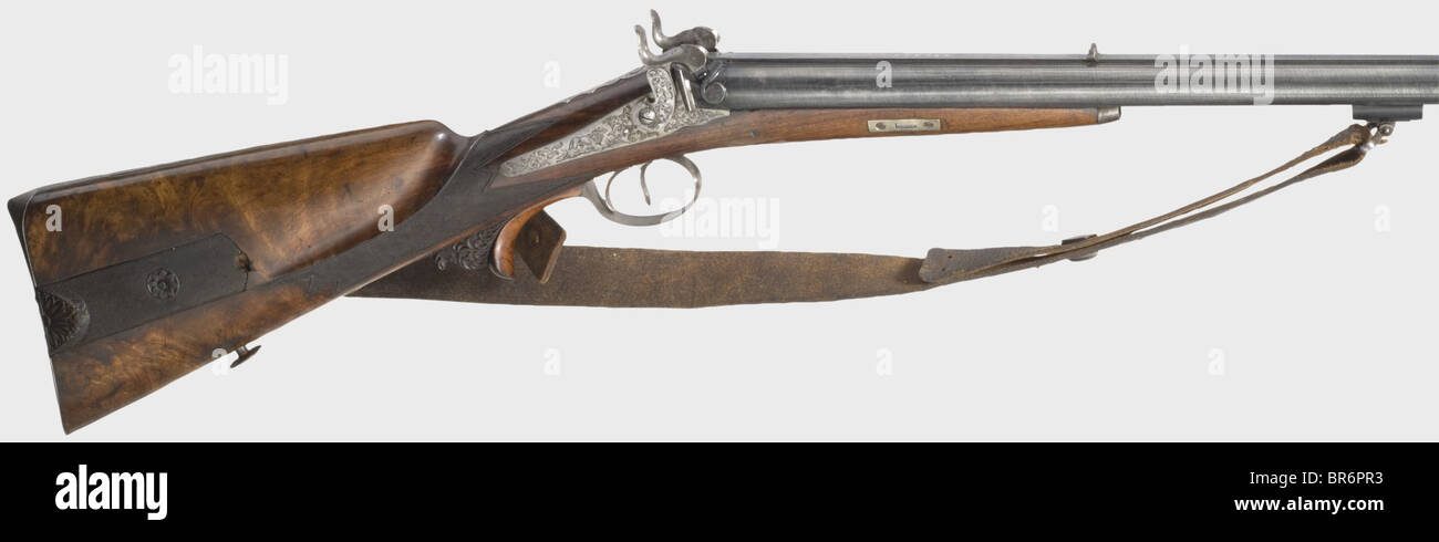 A percussion rifle, Liège(?), circa 1850. Rifled Damascus steel barrels ...