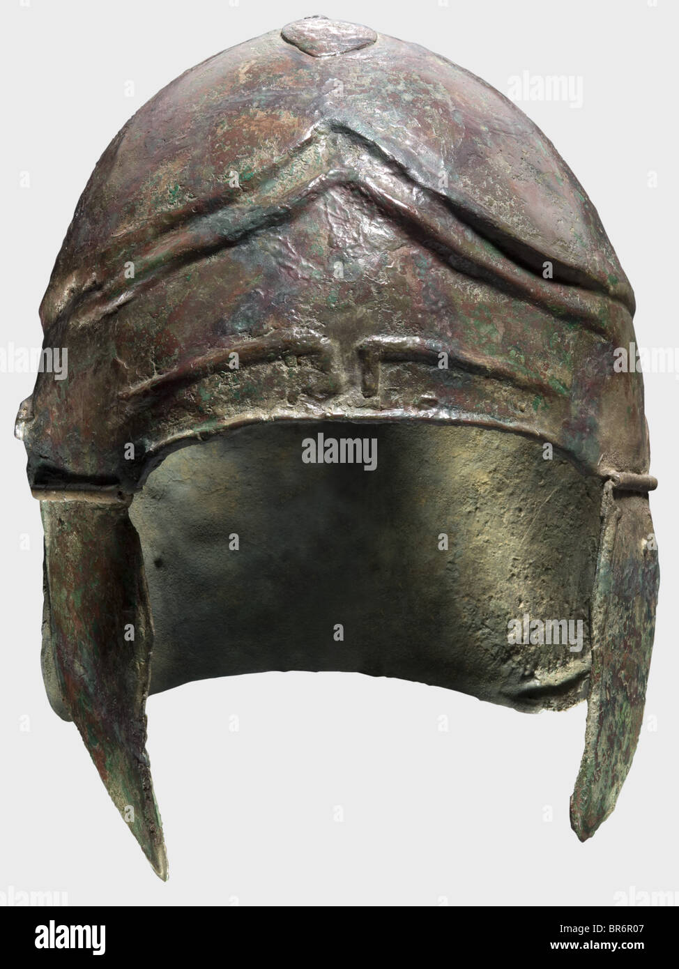 A Chalcidian helmet with cheek pieces, 5th/4th century B.C. Bronze ...