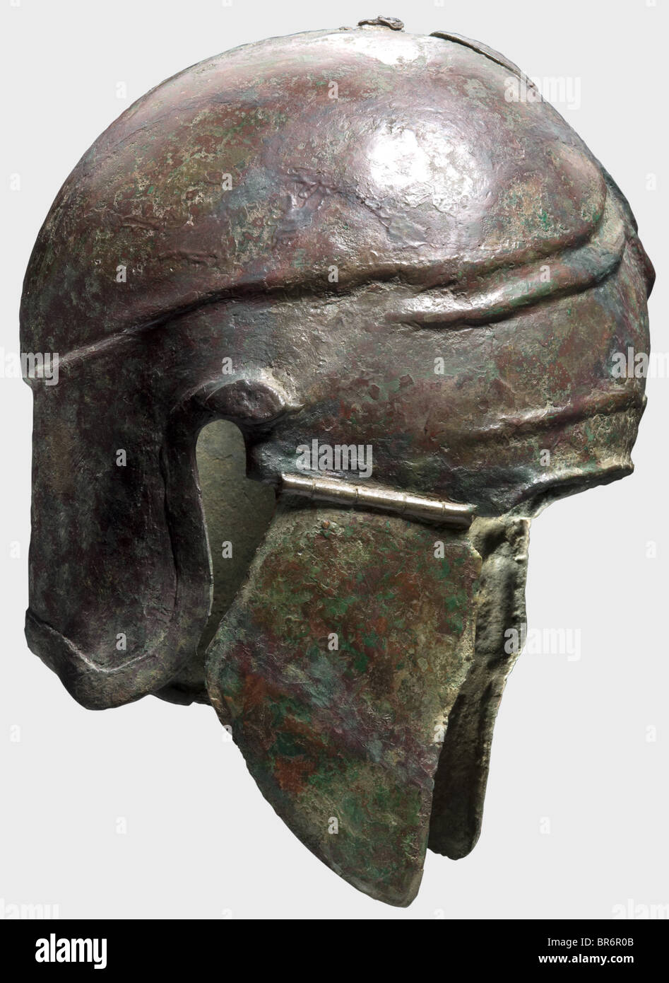 A Chalcidian helmet with cheek pieces, 5th/4th century B.C. Bronze ...
