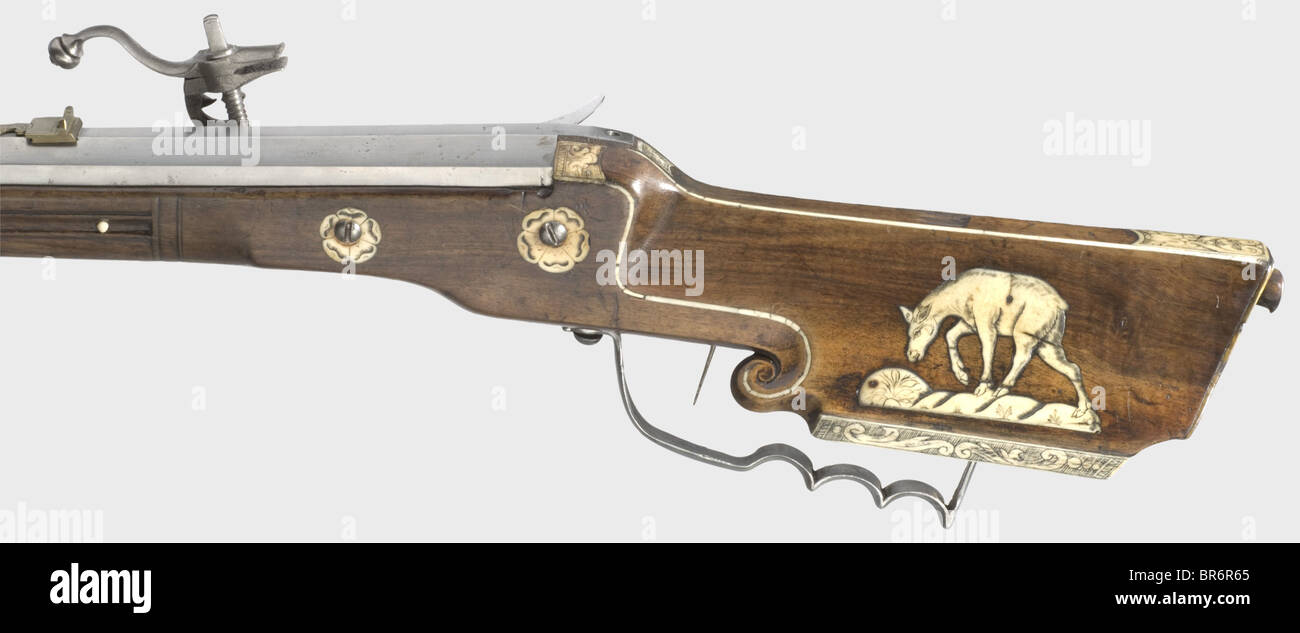 A wheellock rifle, Germany, dated 1657. Octagonal barrel with a ...