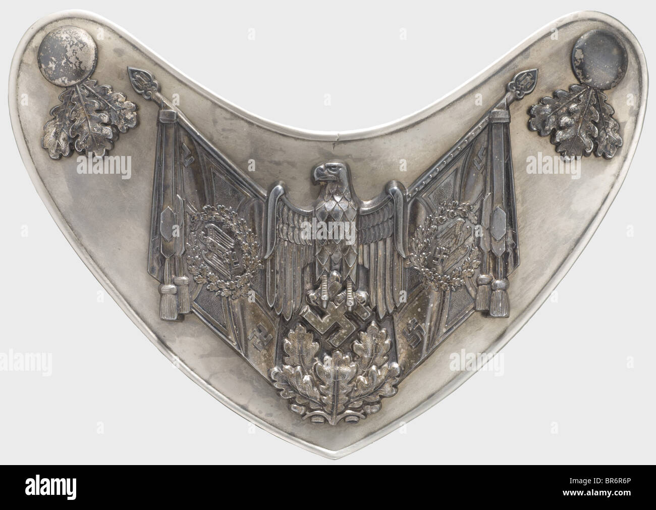 A gorget for a standard bearer., Silver-plated, kidney-shaped brass ...