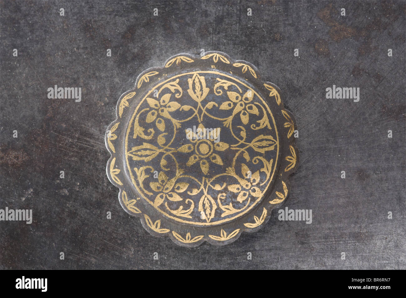 An Indian gold-inlaid shield, Lahore, 19th century. Slightly domed ...