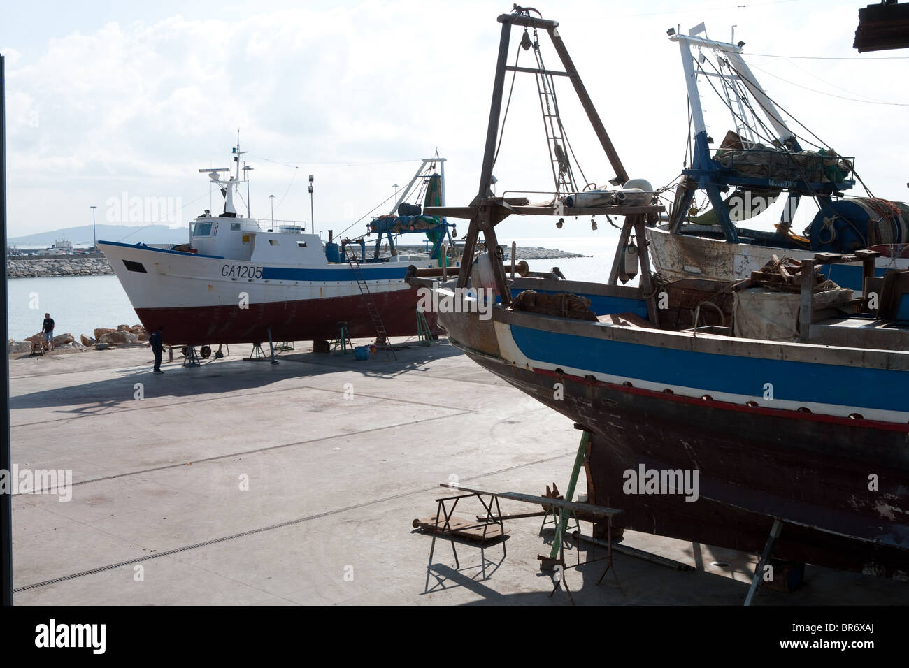 Fishing boats trawlers in shipyard Mediterranean sea Italy Stock Photo ...