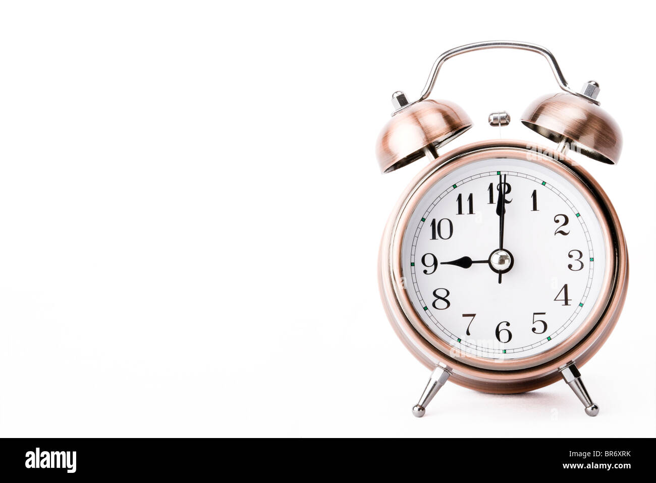 Copper alarm clock showing 9 o'clock side leaving a blank Stock Photo ...