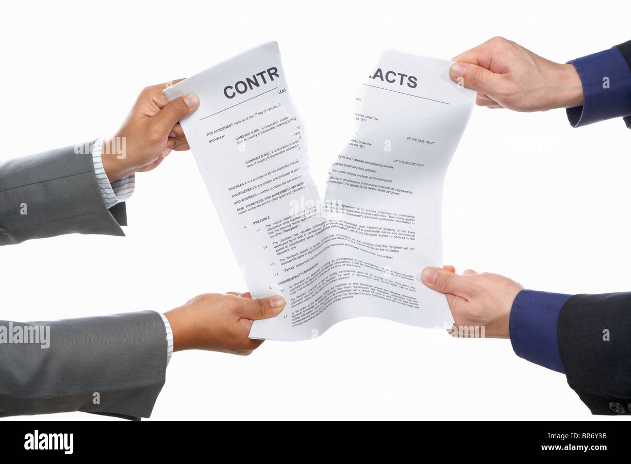 Two business people fight over contracts, shot against white background ...