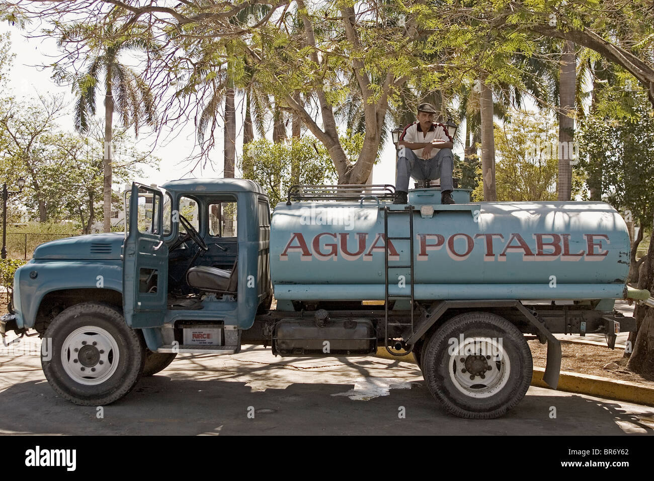 His tank empty after a delivery a driver relaxes on the top of his ...