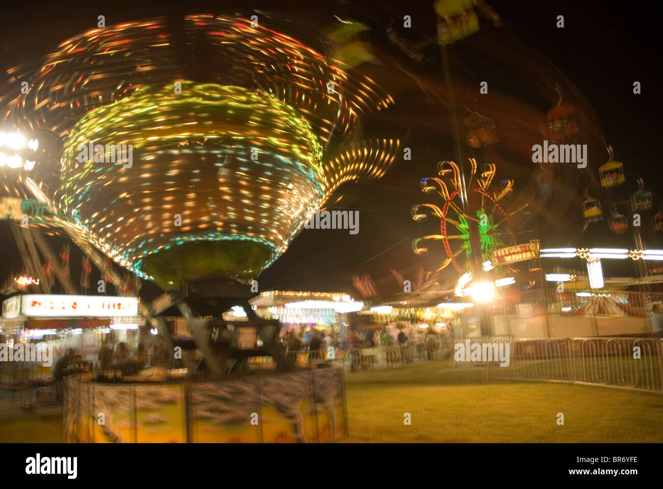 The carnival rides at night at the Country Fair in Cummings Georgia USA ...