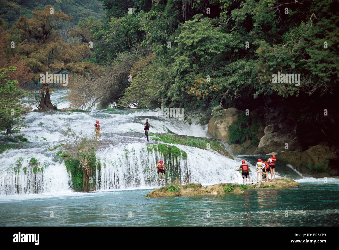 Tourists canyoning down Micos waterfalls, Huasteca Potosina, Mexico ...