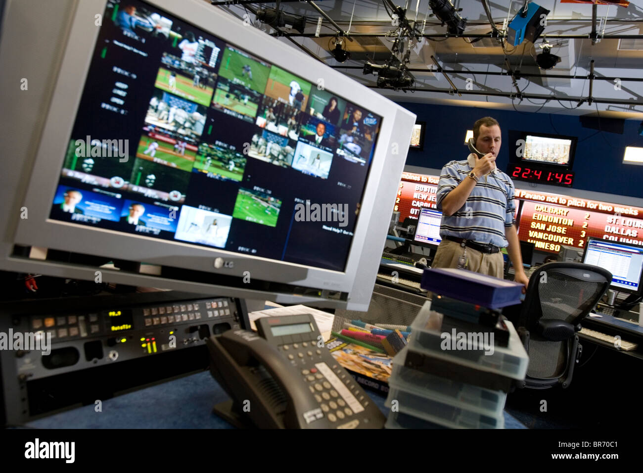 A man talks on the photo inside the control room of ESPN in Bristol ...