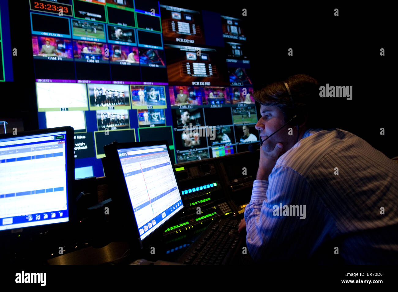A man watches a computer monitor inside control room of ESPN in Bristol ...