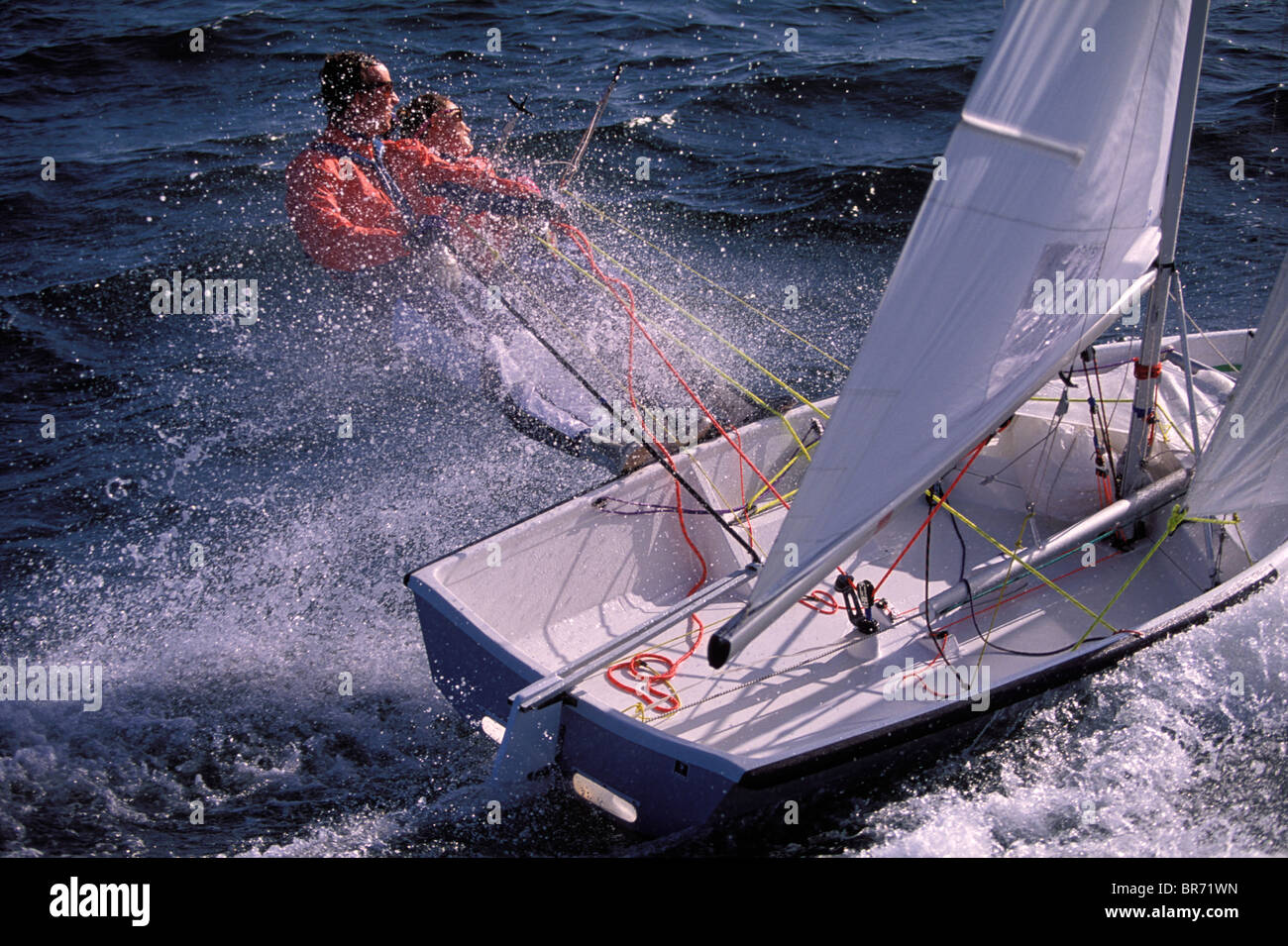 Two people trapezing on a One Design 14 foot dinghy Stock Photo - Alamy