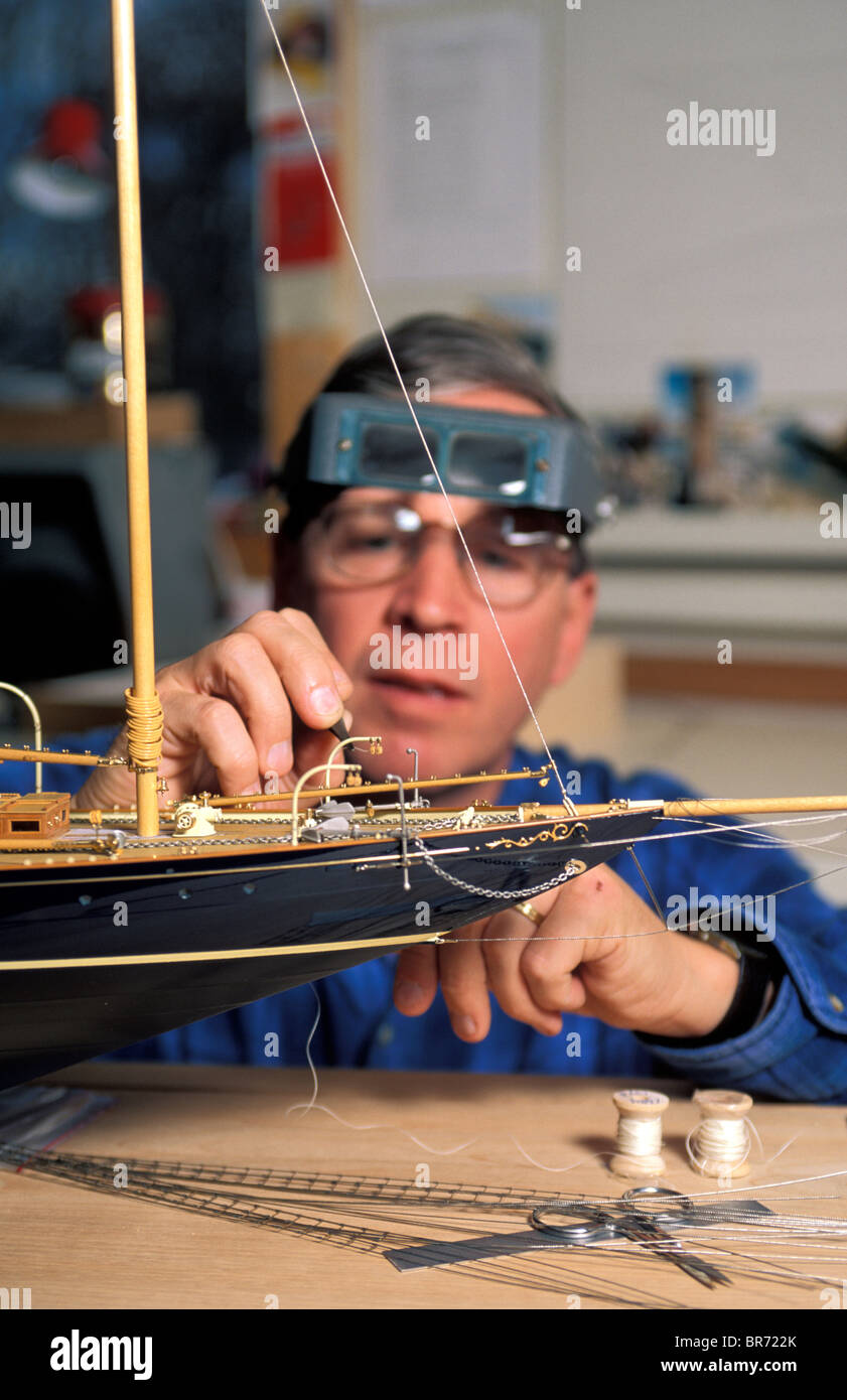 Model boat builder, Robert Eddy, adding detail to a scale model of the ...