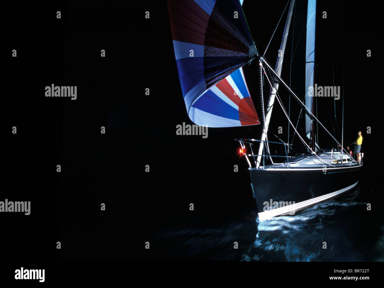 Trimming the spinnaker aboard a 31 foot C&C sloop while night cruising ...