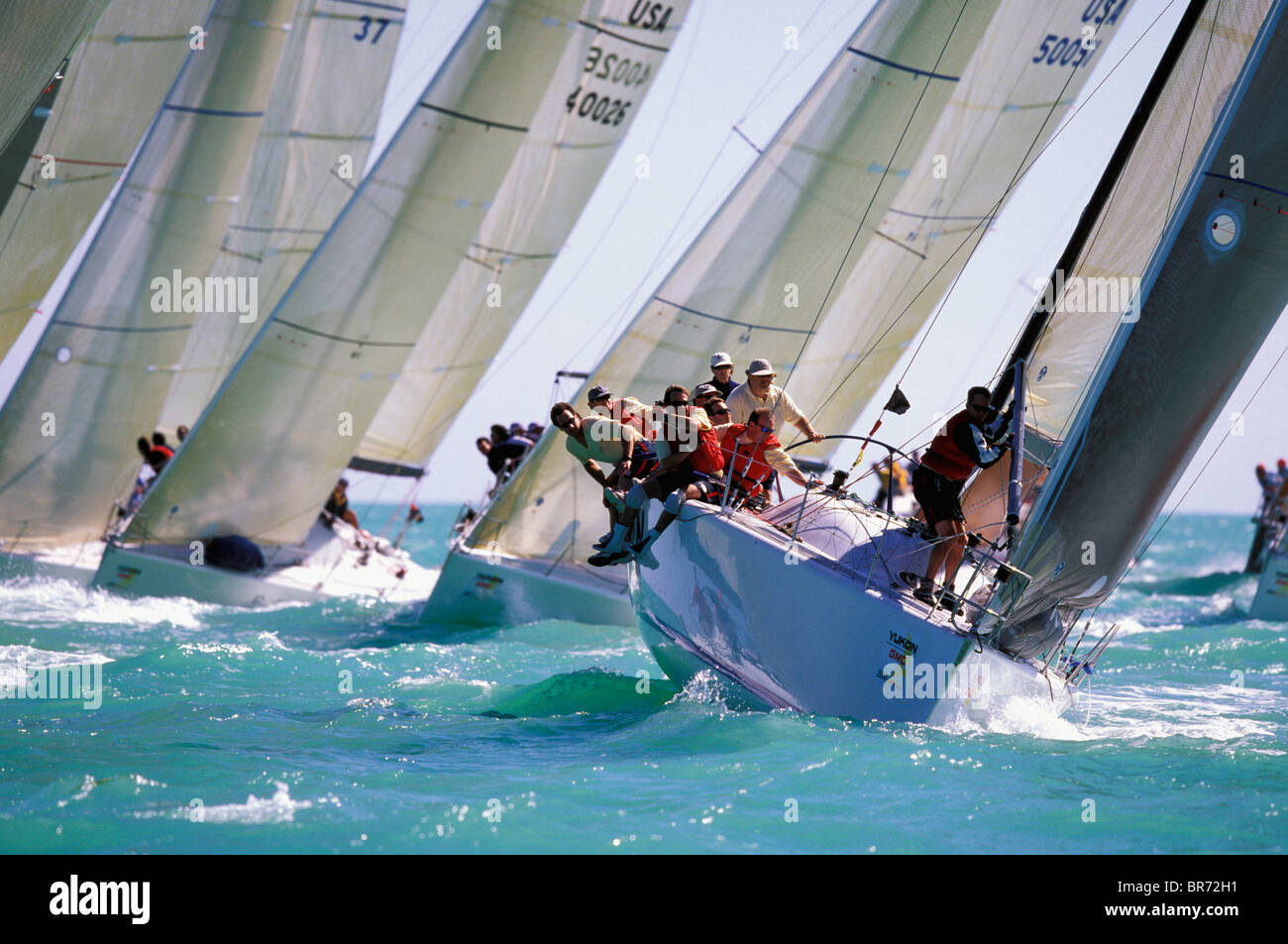The bowman preparing the spinnaker pole as the fleet approach the ...