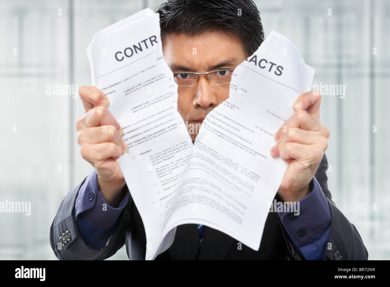 Chinese businessman tearing up the contrat papers Stock Photo - Alamy