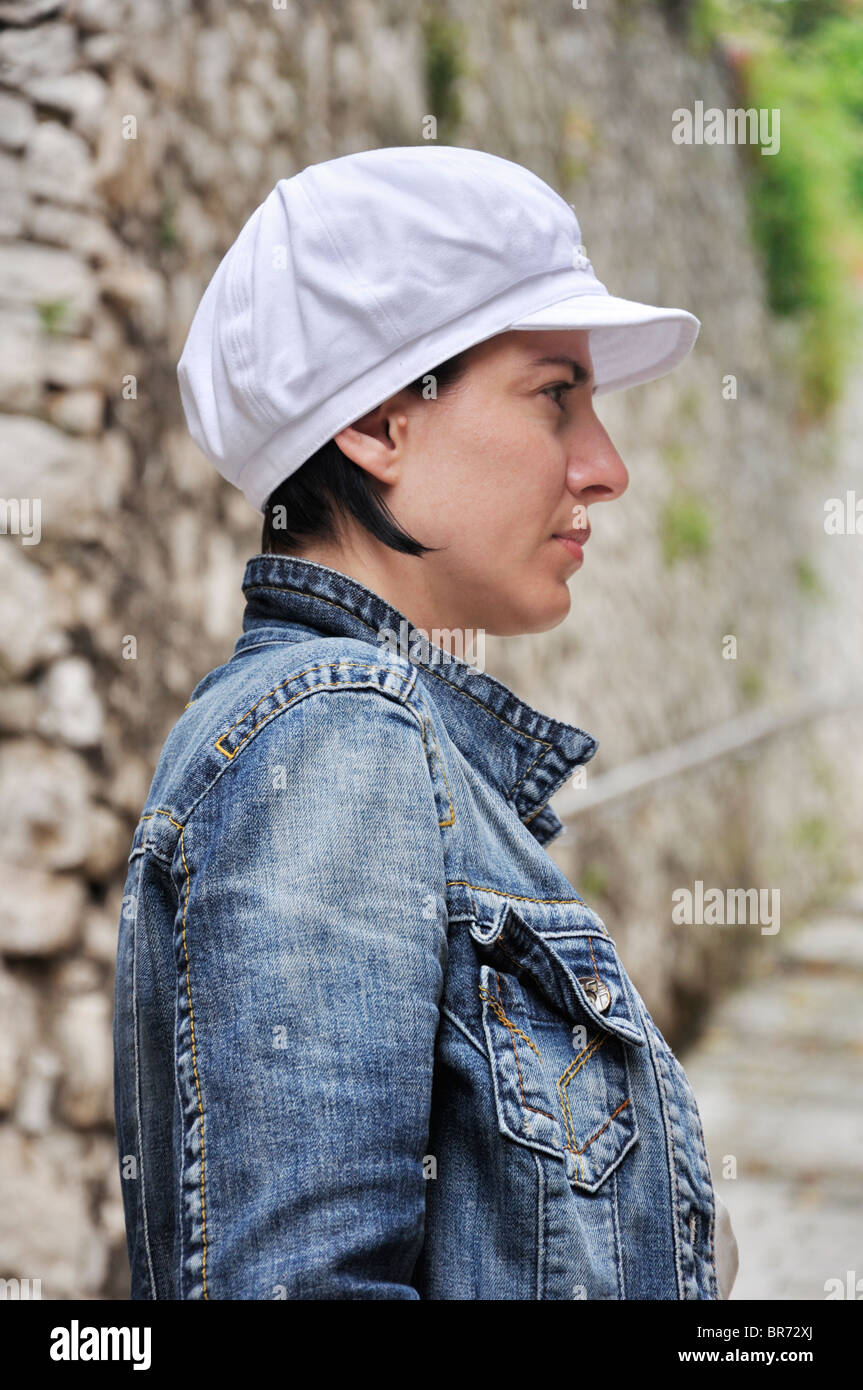 Young woman portrait wearing cap Stock Photo - Alamy