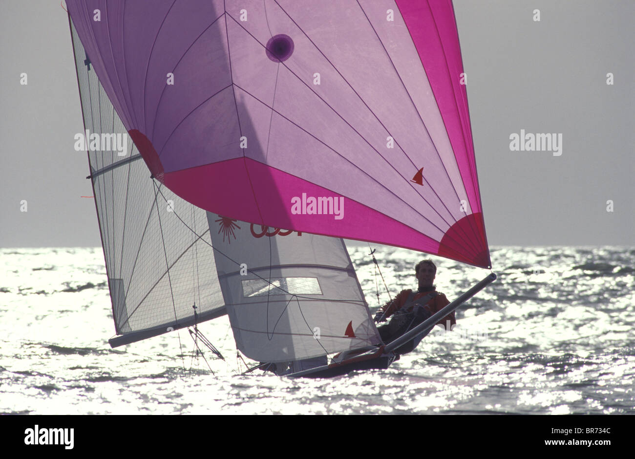 Dinghy sailing using spinnaker Stock Photo - Alamy