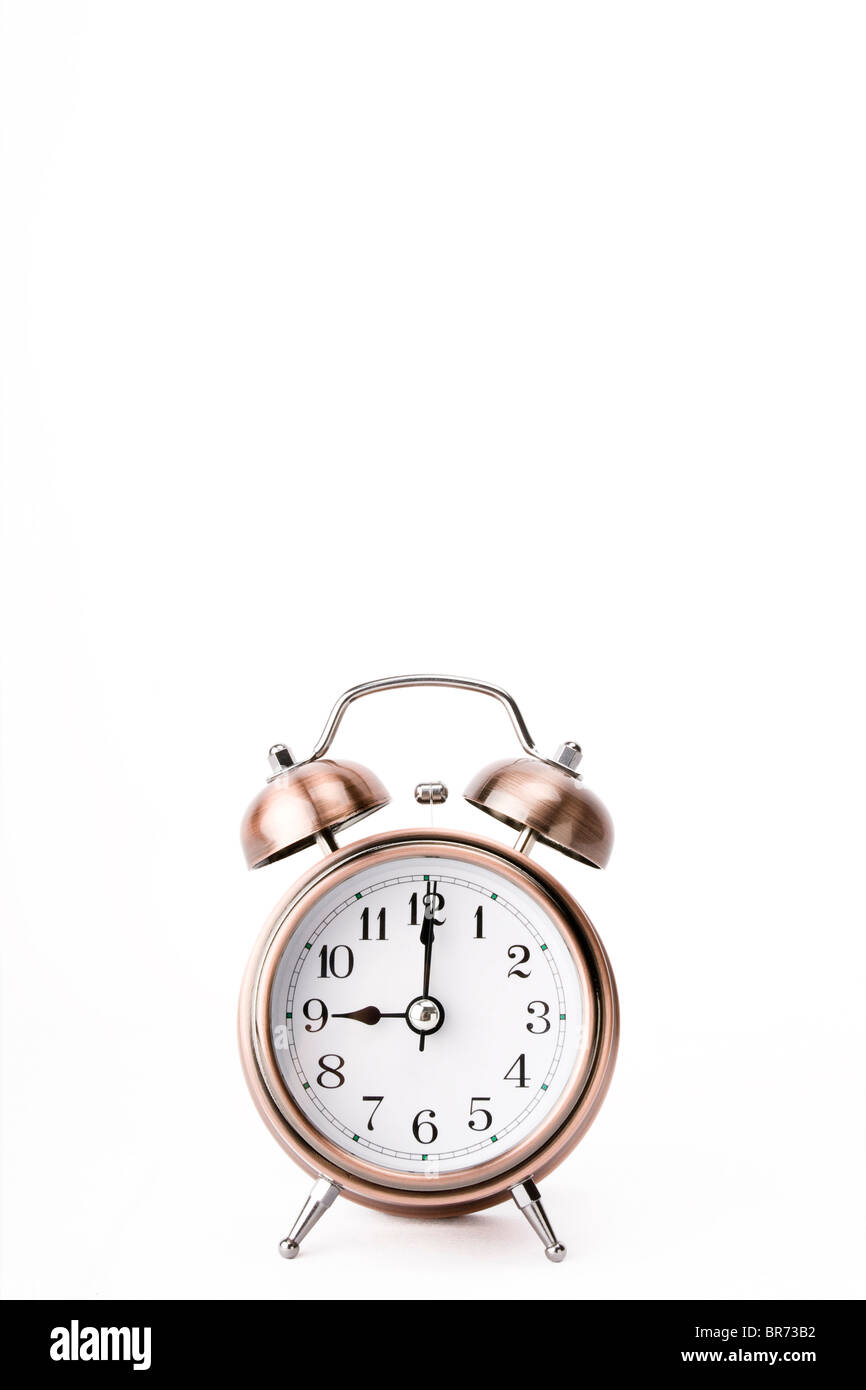 Copper alarm clock showing 9 o'clock side leaving a blank Stock Photo ...