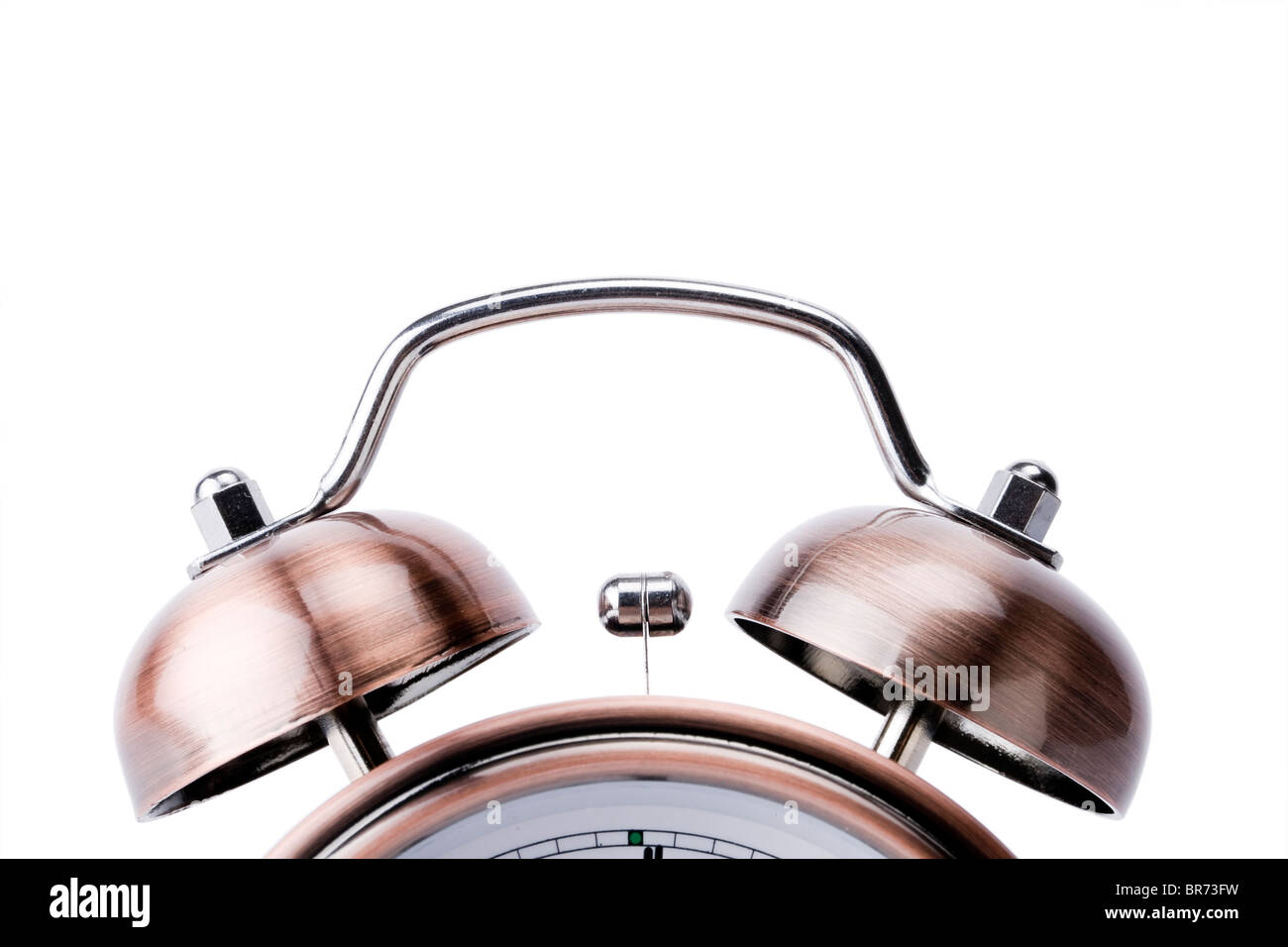 Copper alarm clock with bells on white background Stock Photo - Alamy