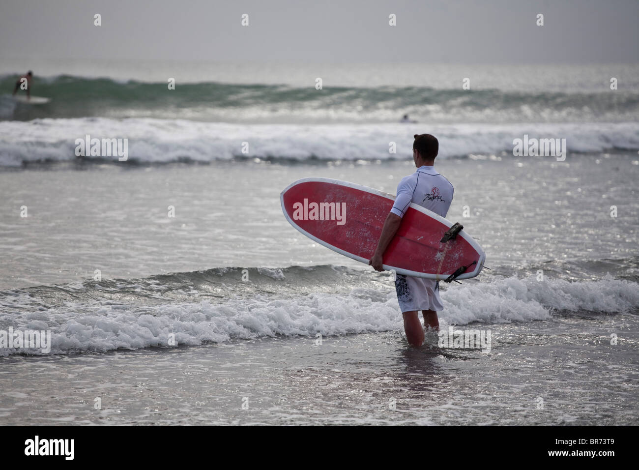 A young surfer dreaming of his next wave Stock Photo - Alamy
