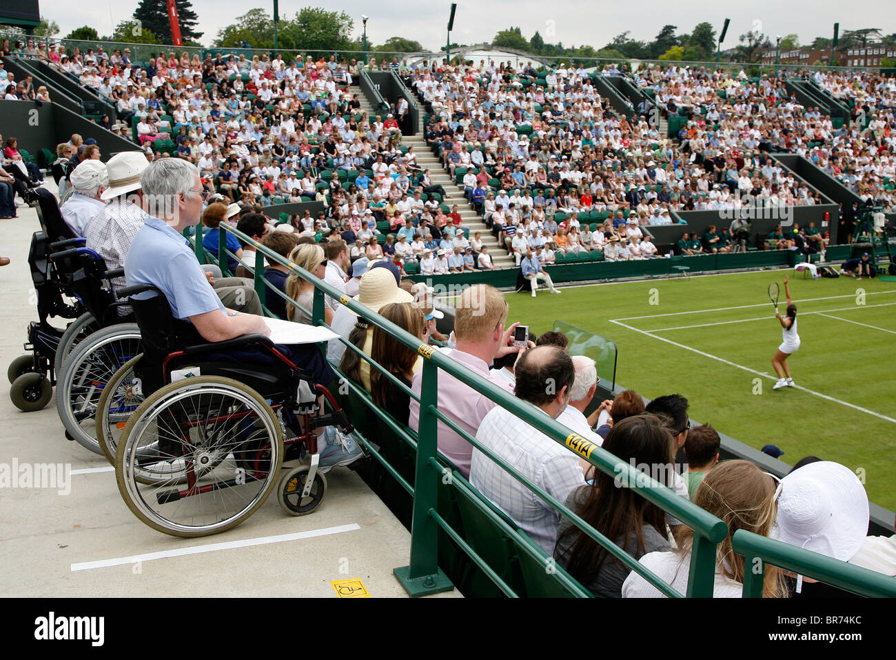 Disabled spectators in wheelchairs watch on the new Court 2 at the ...