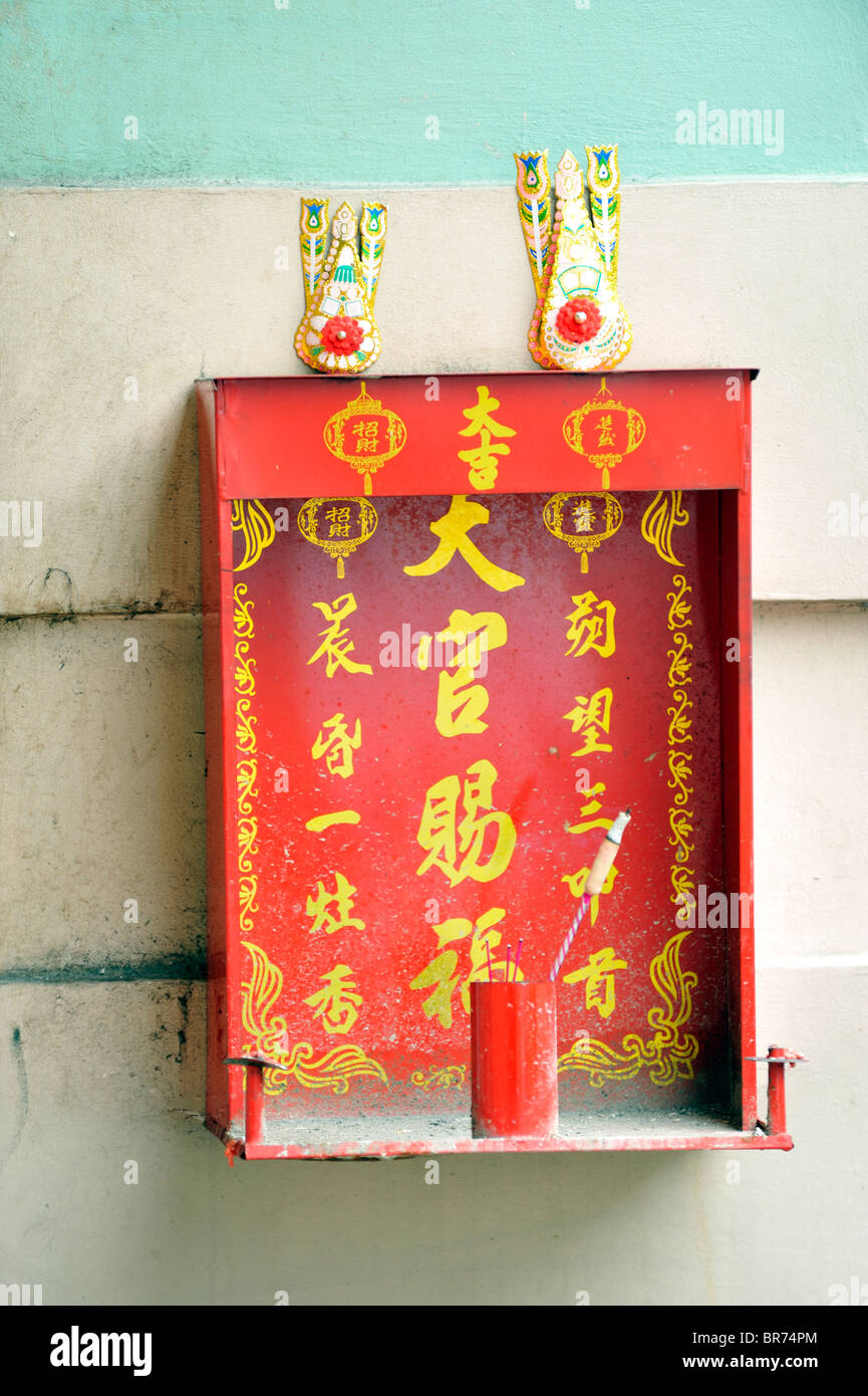 Chinese offering outside a shop in Little India, Singapore, seeking ...