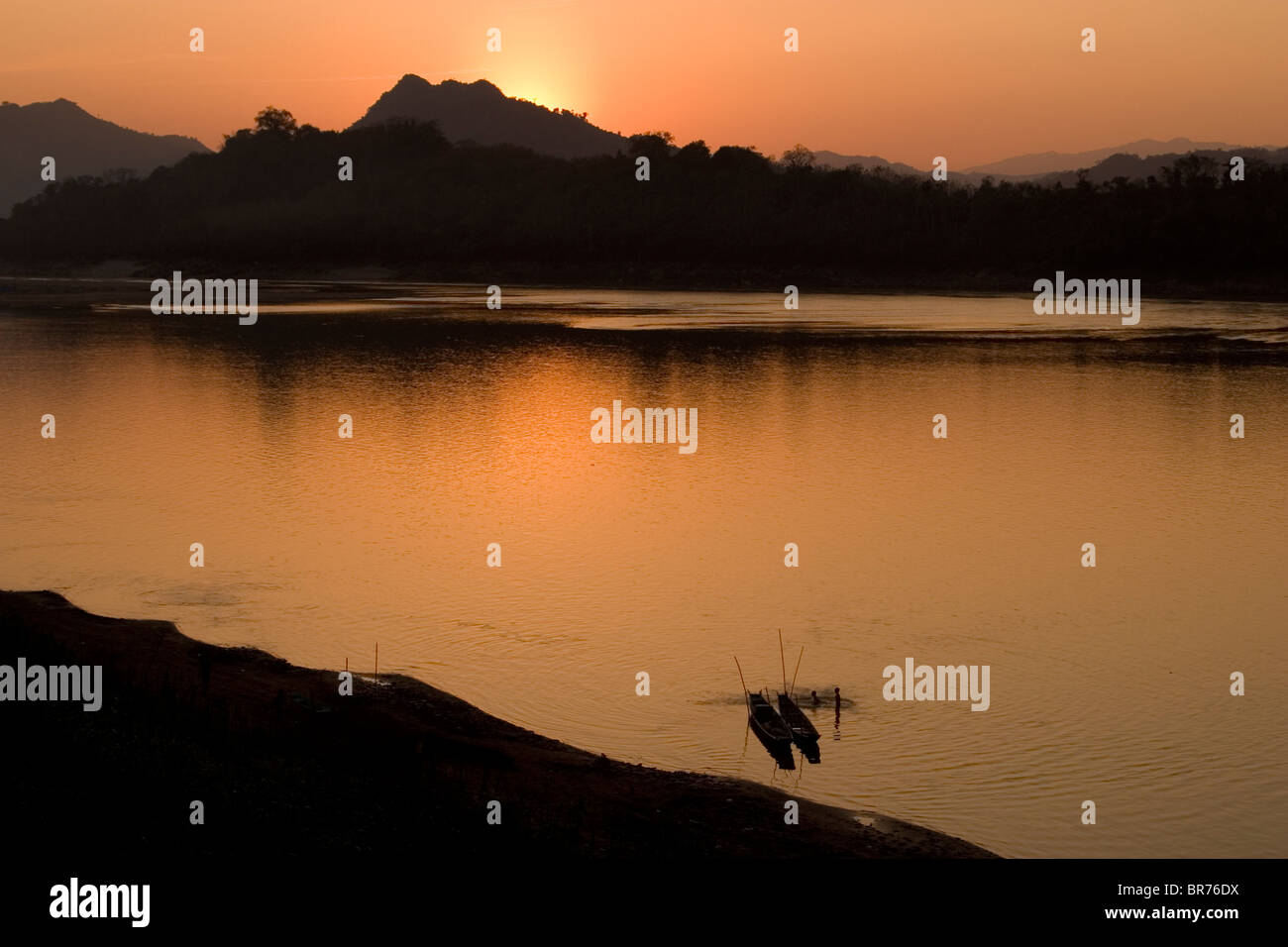 the eternally beautiful sunset over the mekon river Laos Stock Photo ...