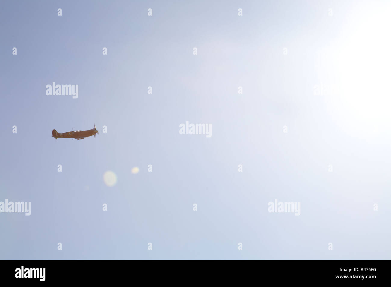 spitfire heading into the sun Stock Photo - Alamy