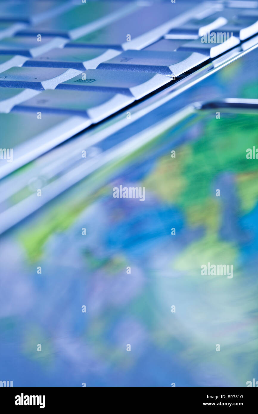 Globe and computer Stock Photo - Alamy