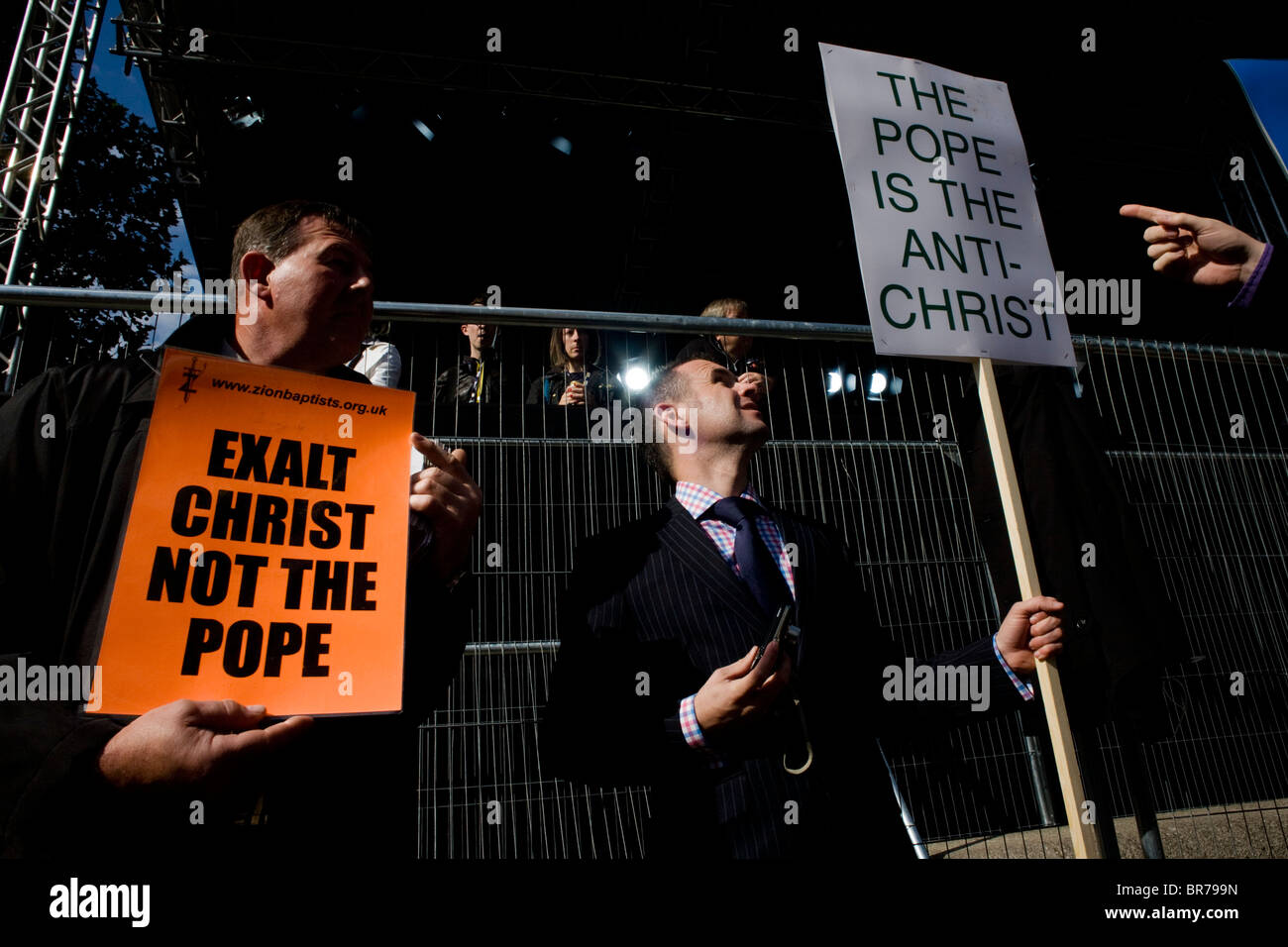 Anti-Papal protesters hold placards during Pope Benedict XVI's papal ...