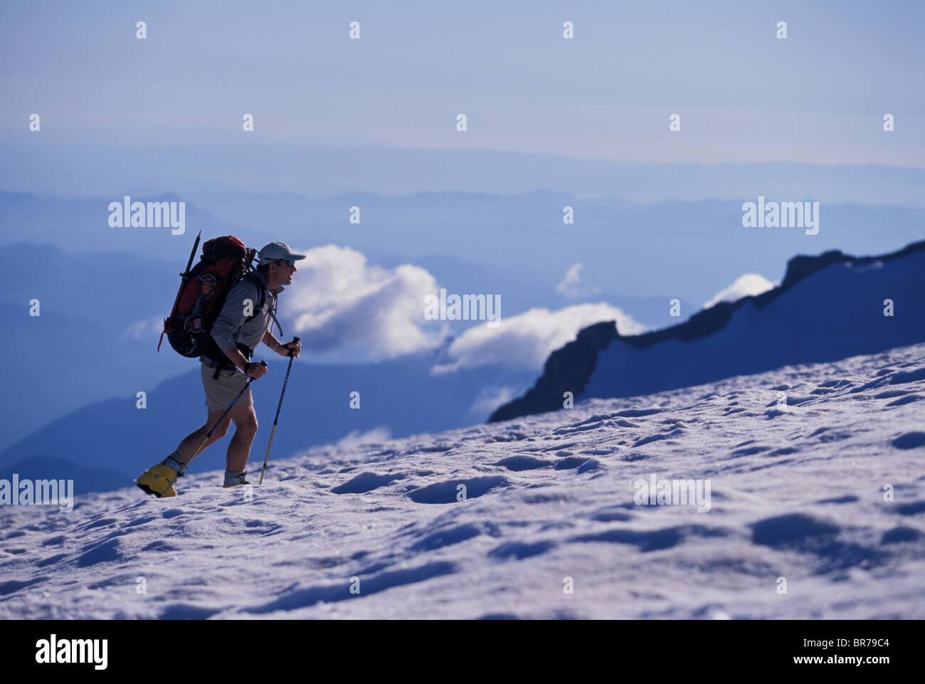 Man climbing Mount Rainier Washington Stock Photo - Alamy