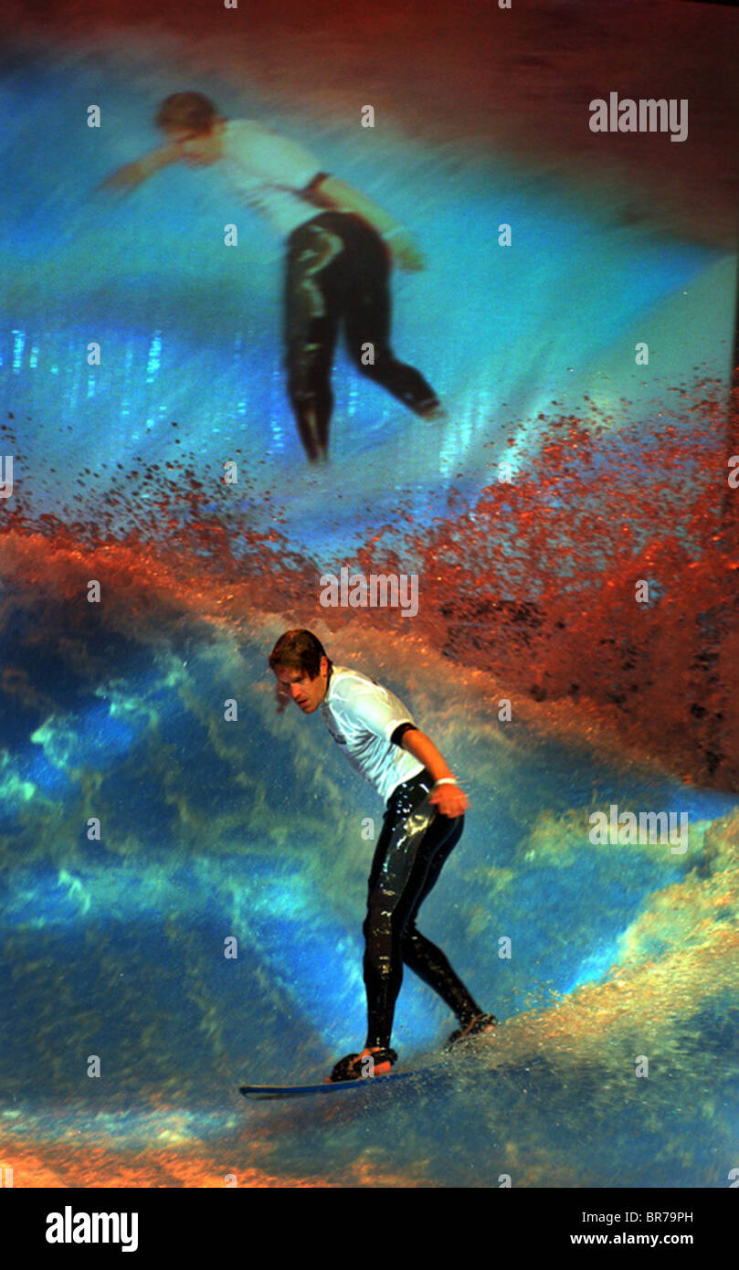 A surfer surfs an artificial wave Stock Photo - Alamy