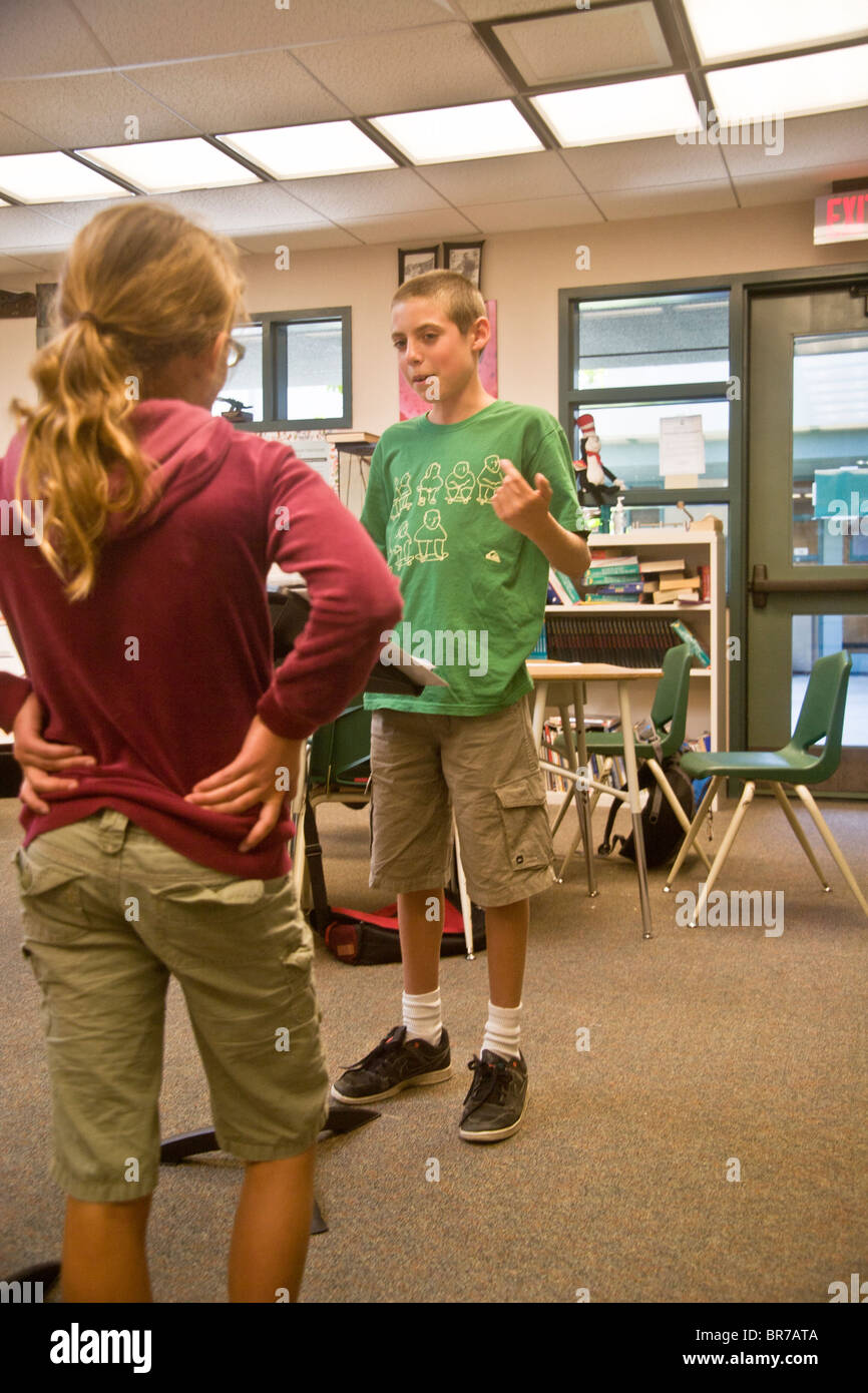 An unprepared middle school student seems unsure of himself during a ...
