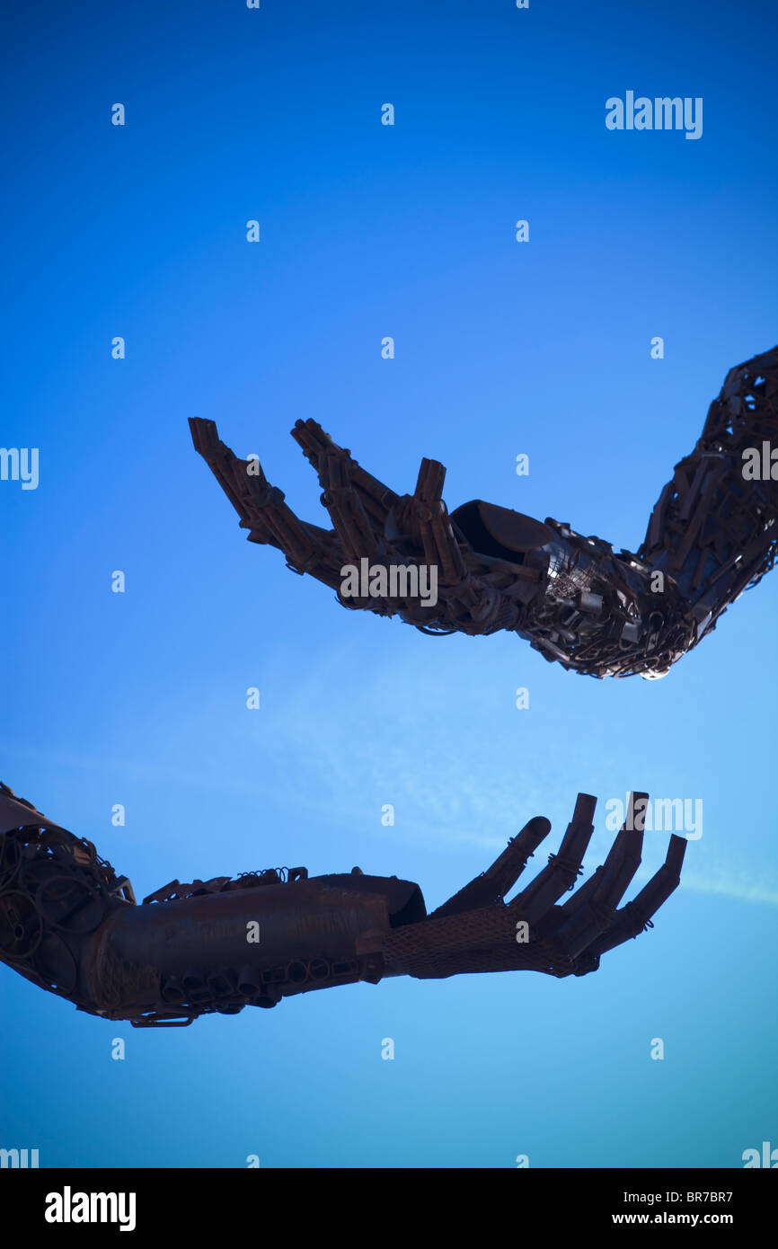 Metal sculpture hands Stock Photo - Alamy