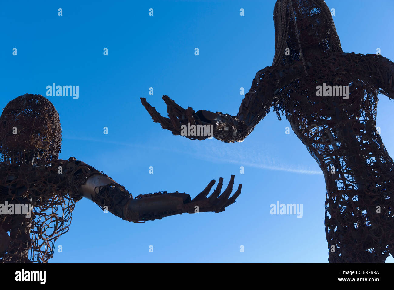 Metal sculpture of two people Stock Photo - Alamy