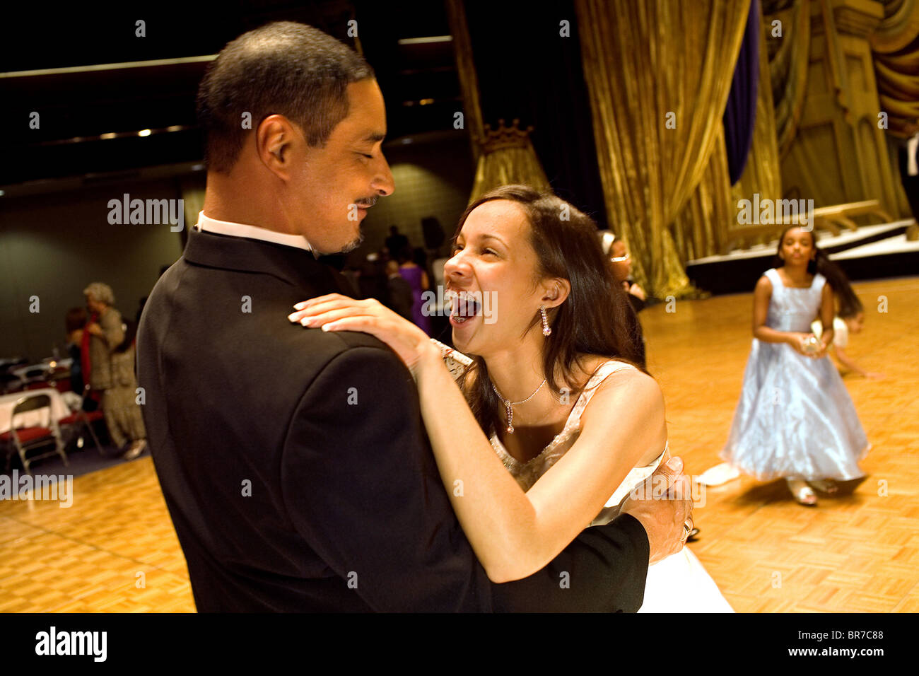 A teenage debutante shares a dance with her proud father during New ...