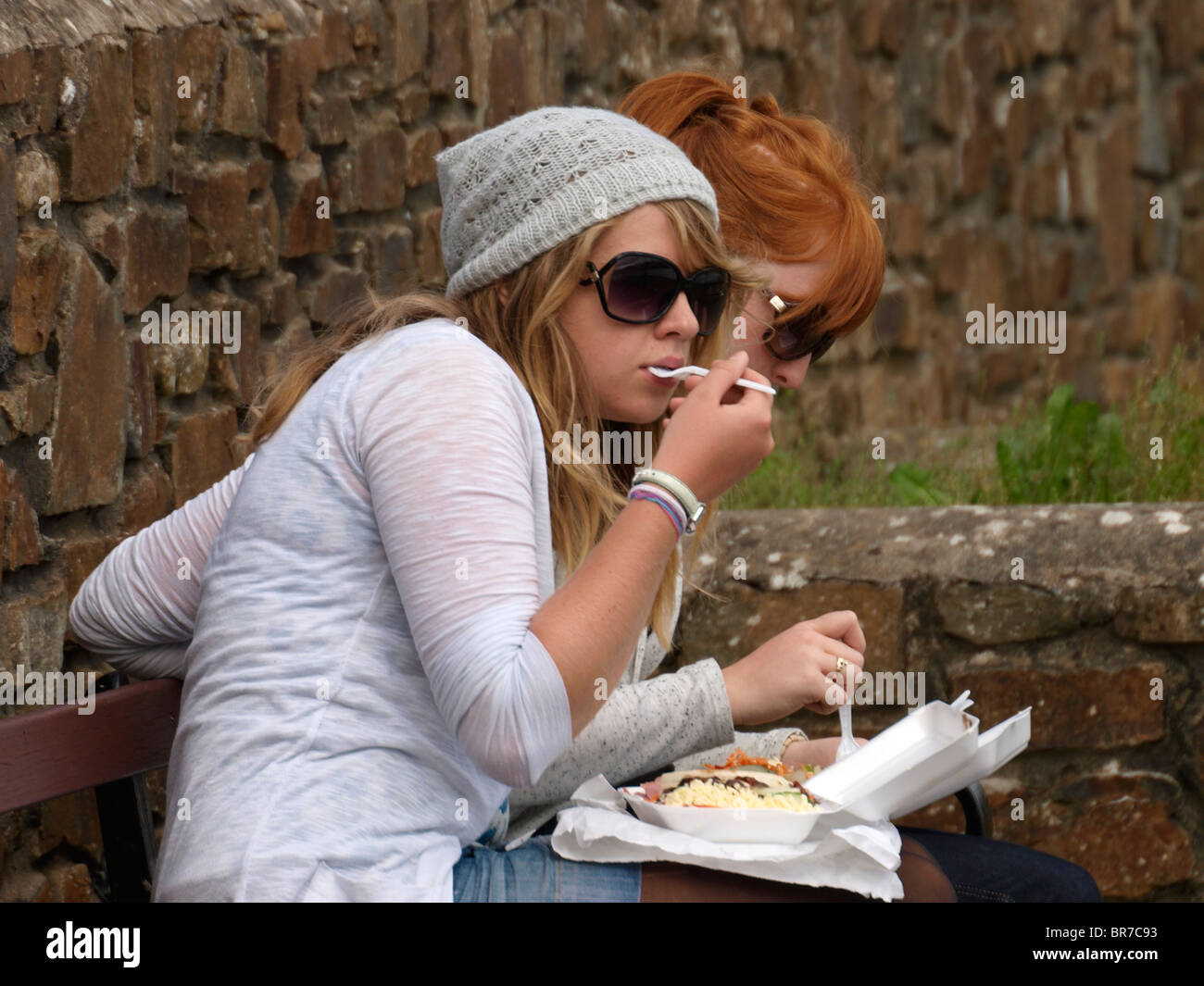 Two young girls eating lunch, UK Stock Photo - Alamy