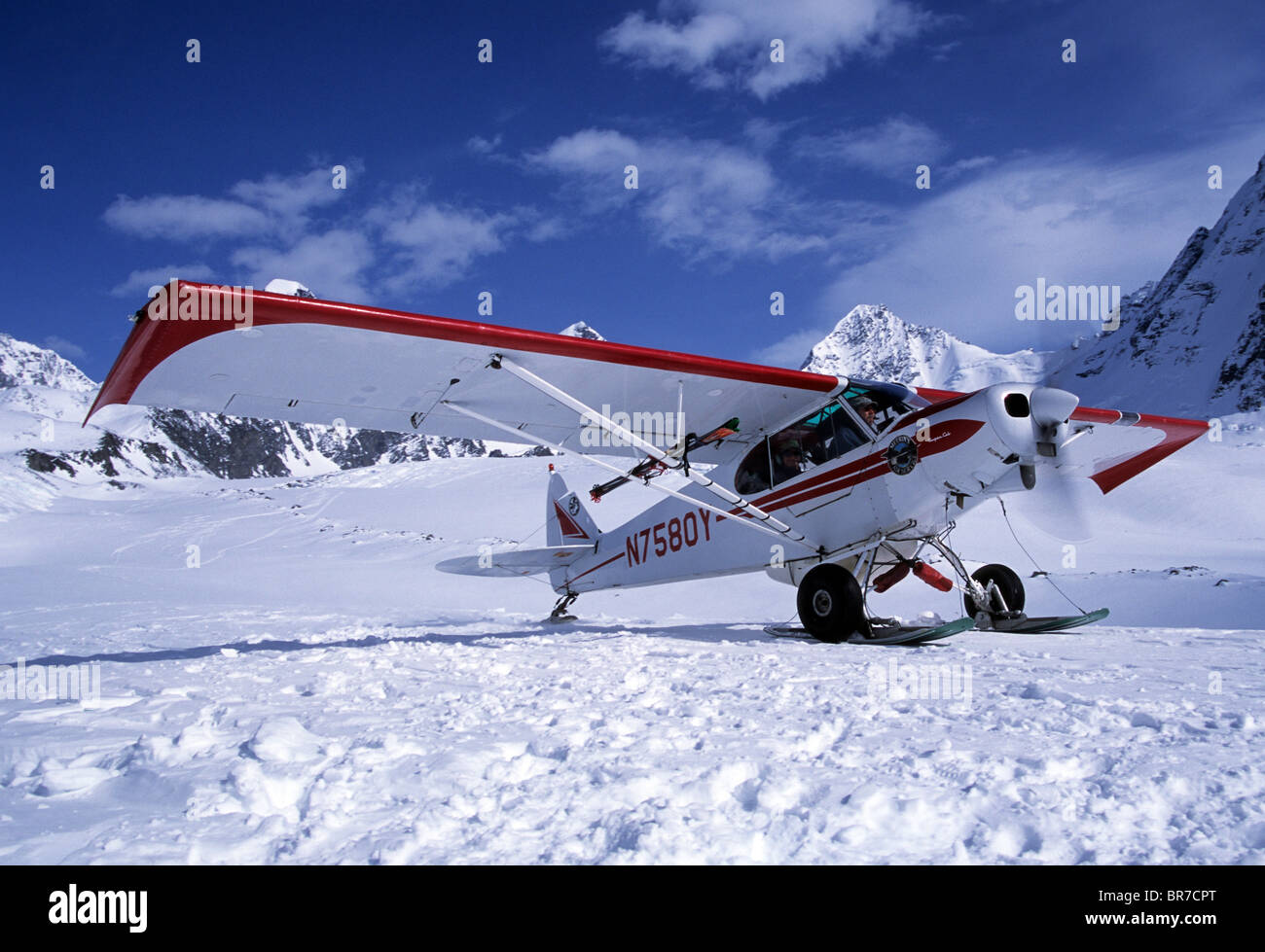 Small bush plane on snow in mountains Stock Photo - Alamy