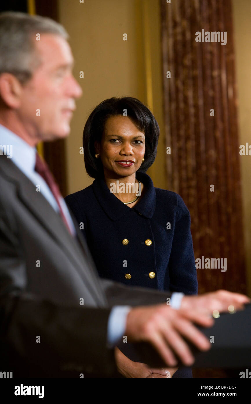 Secretary of State Condoleezza Rice looks on as President Bush speaks ...