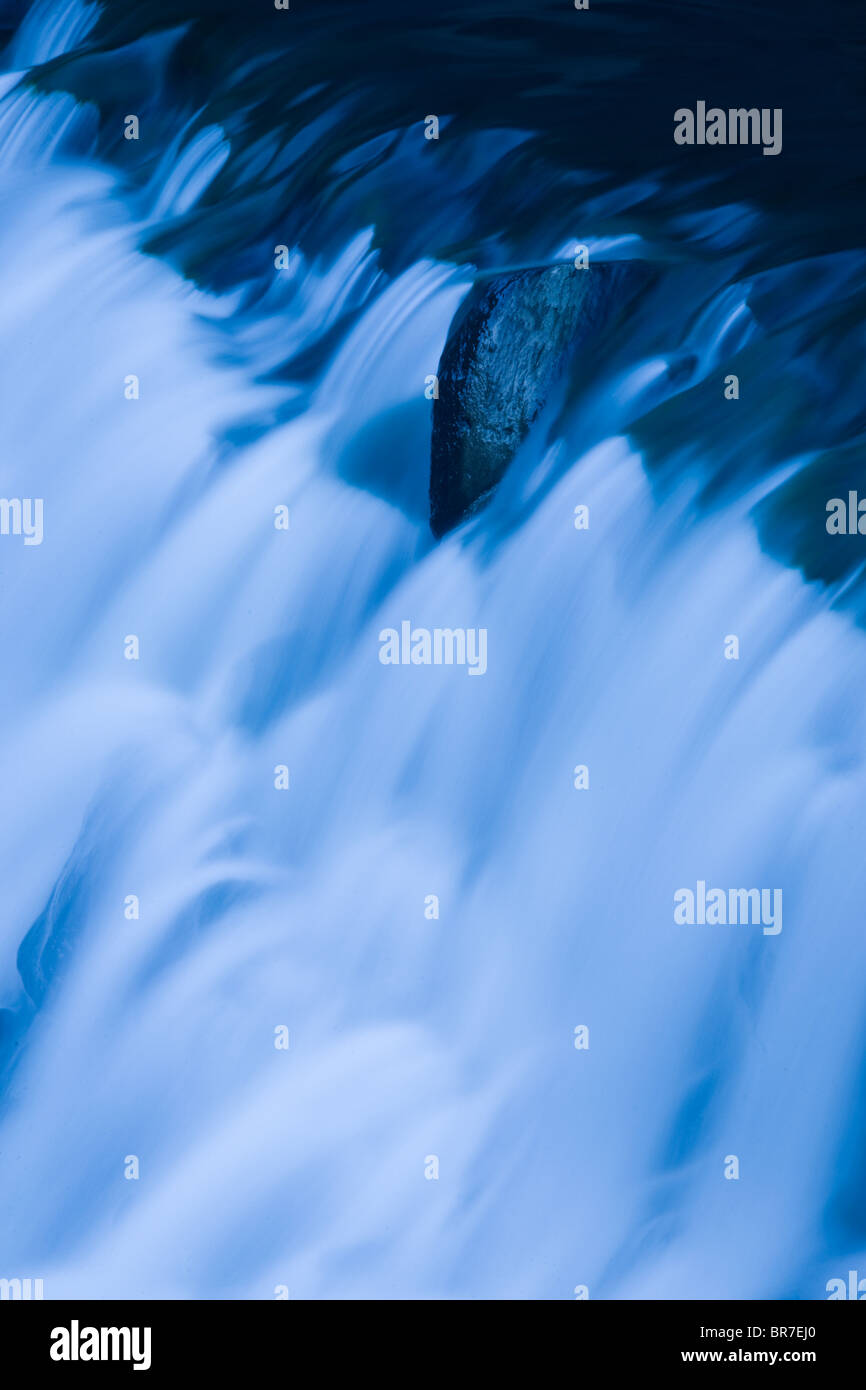 waterfall with stone in the middle Stock Photo - Alamy