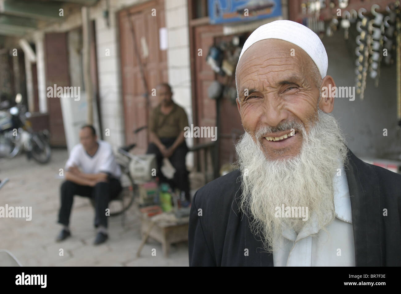 Uyghur man smiling in Kashgar Stock Photo - Alamy