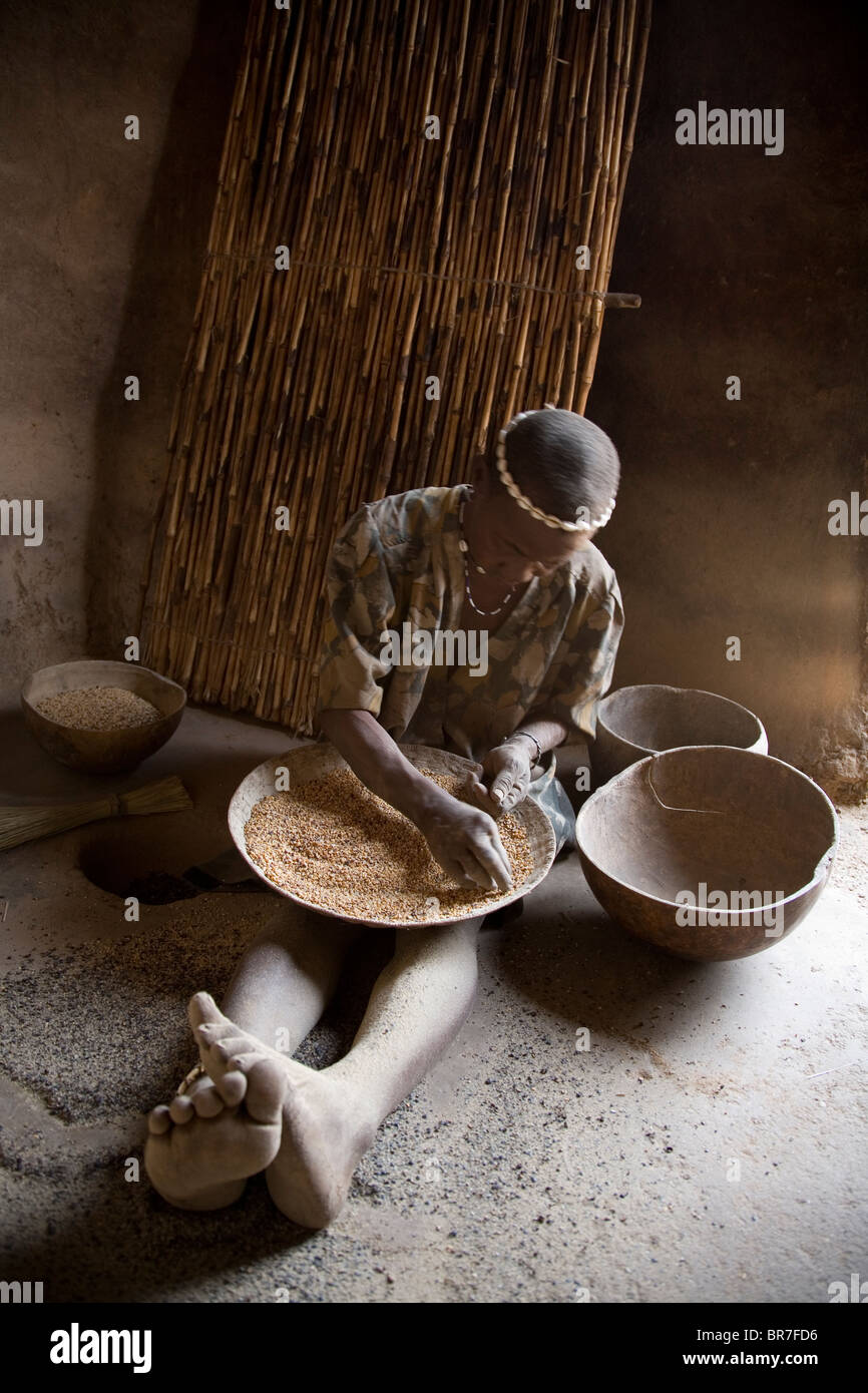Woman sorting grain Stock Photo - Alamy