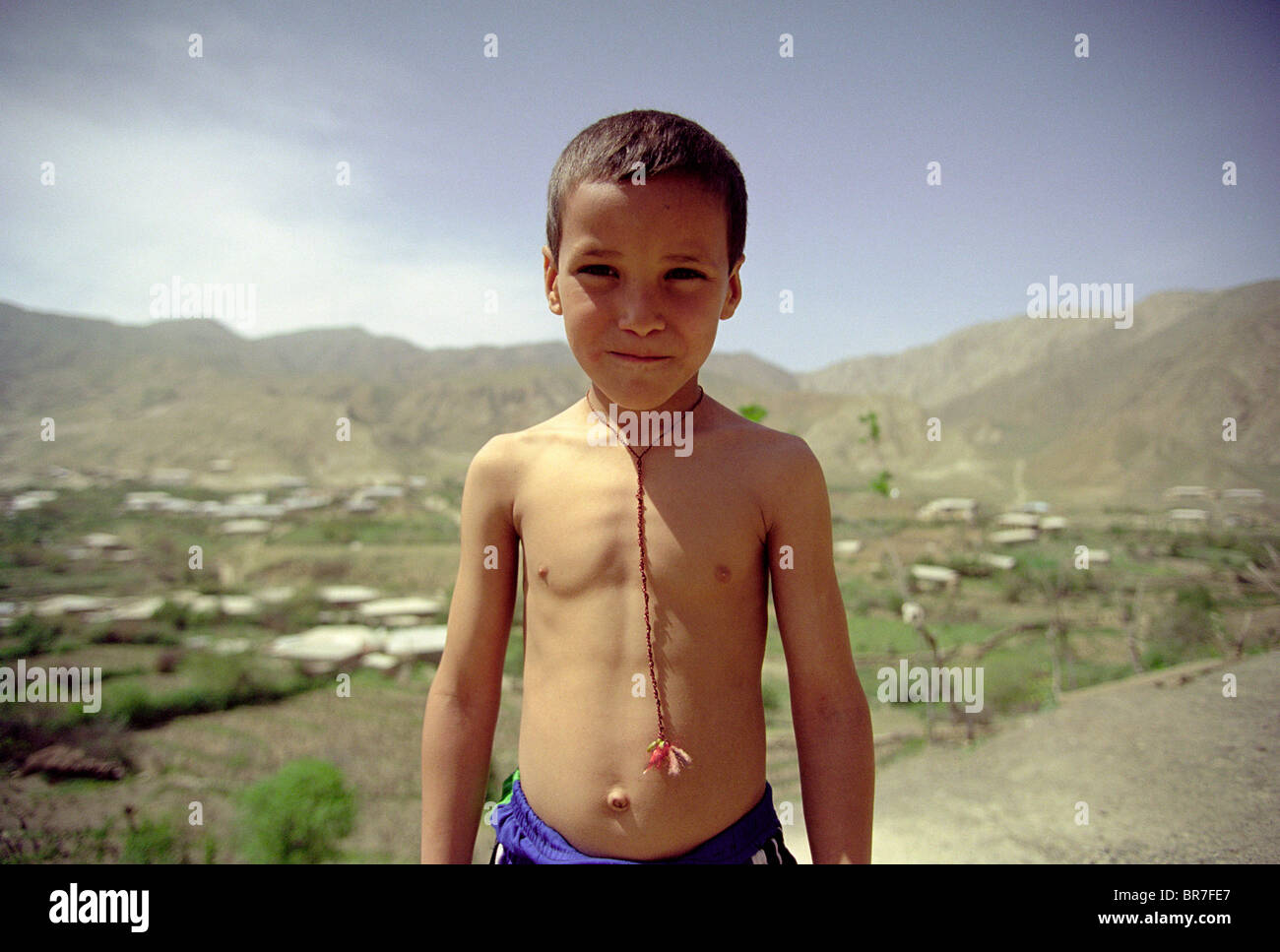 Young Turkmen Boyin the hills Stock Photo - Alamy