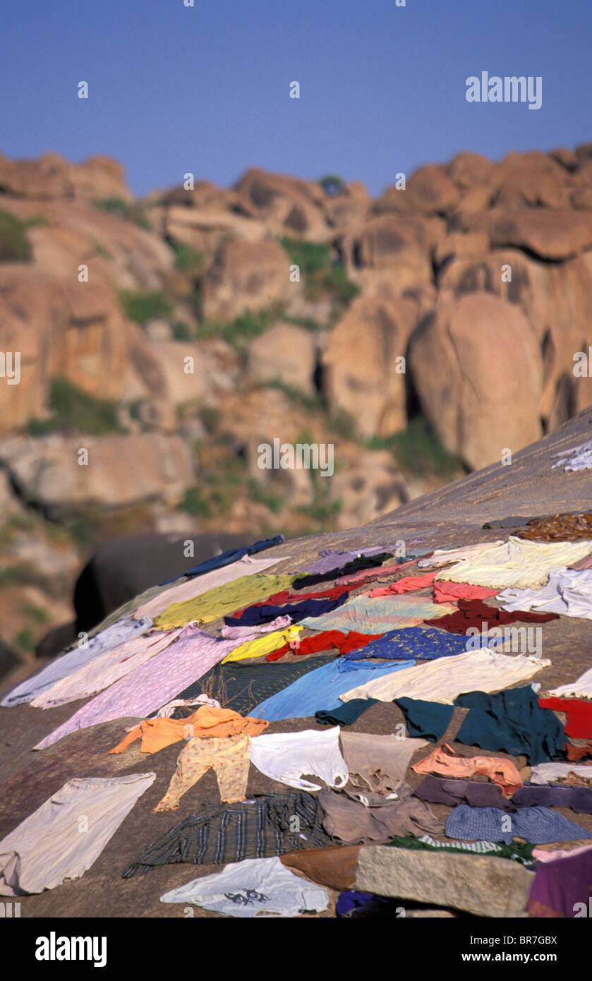 Clothes drying on a rock in Hampi India Stock Photo - Alamy