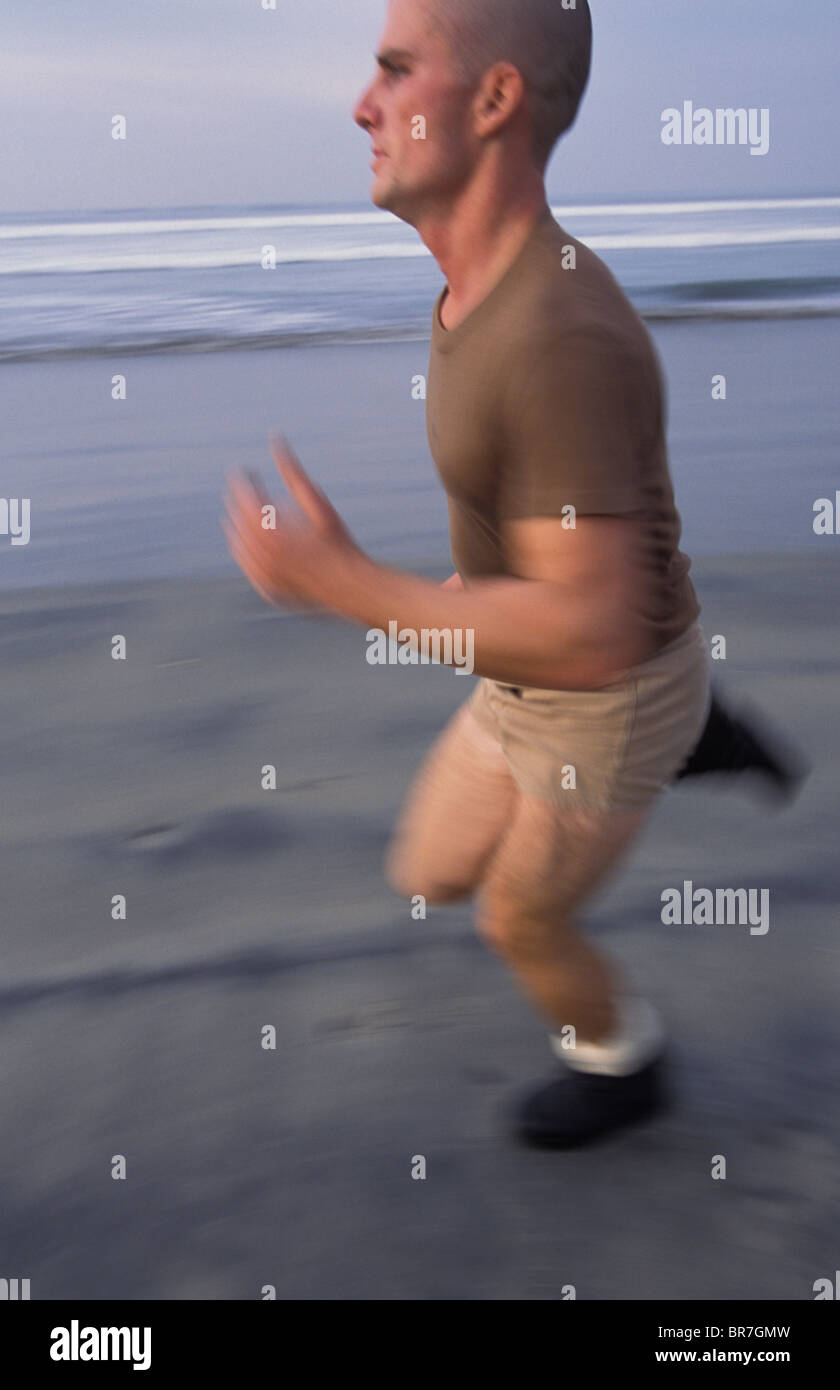 Man running on the beach in San Diego California Stock Photo - Alamy